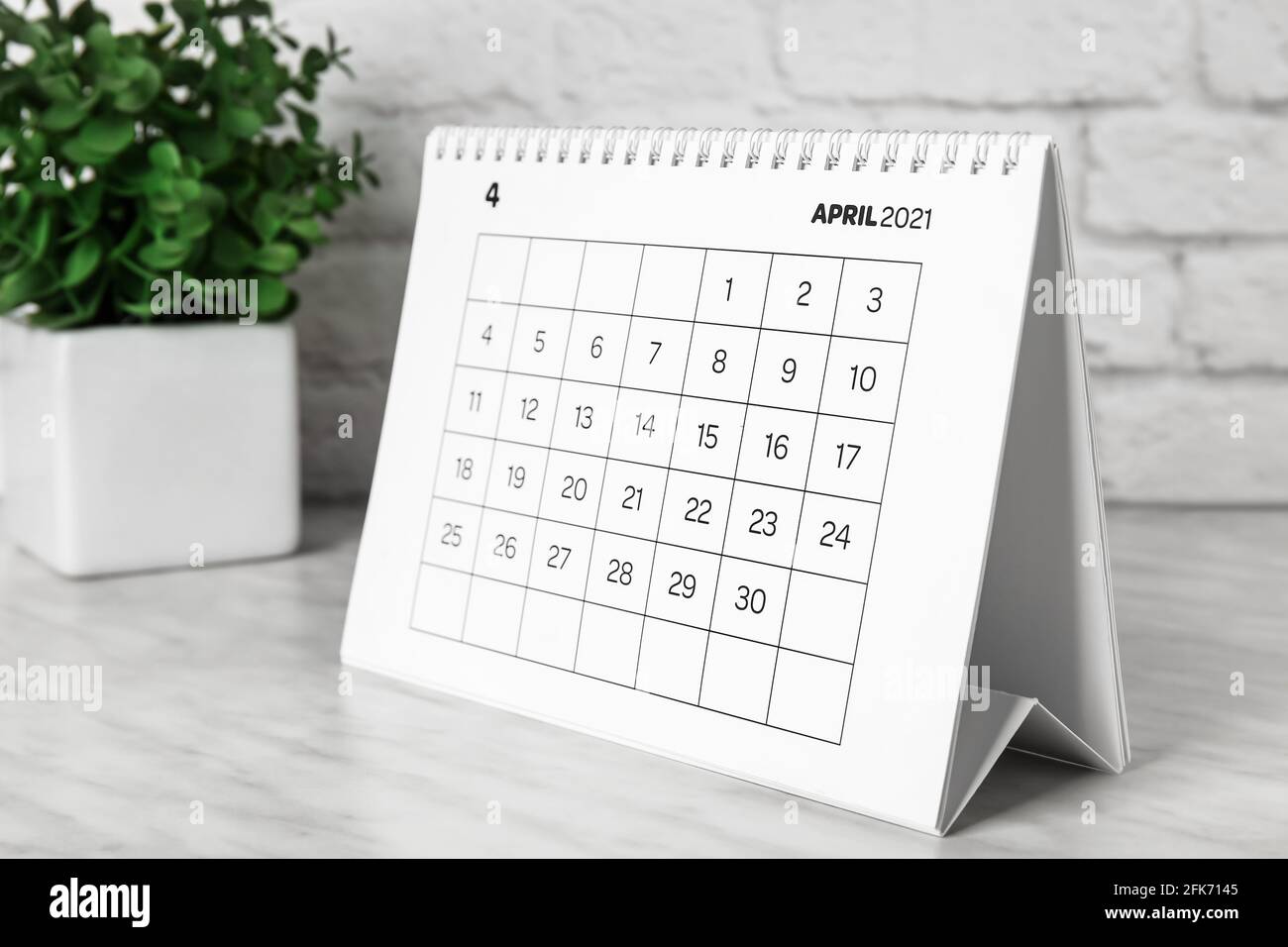 Flip paper calendar on table Stock Photo - Alamy