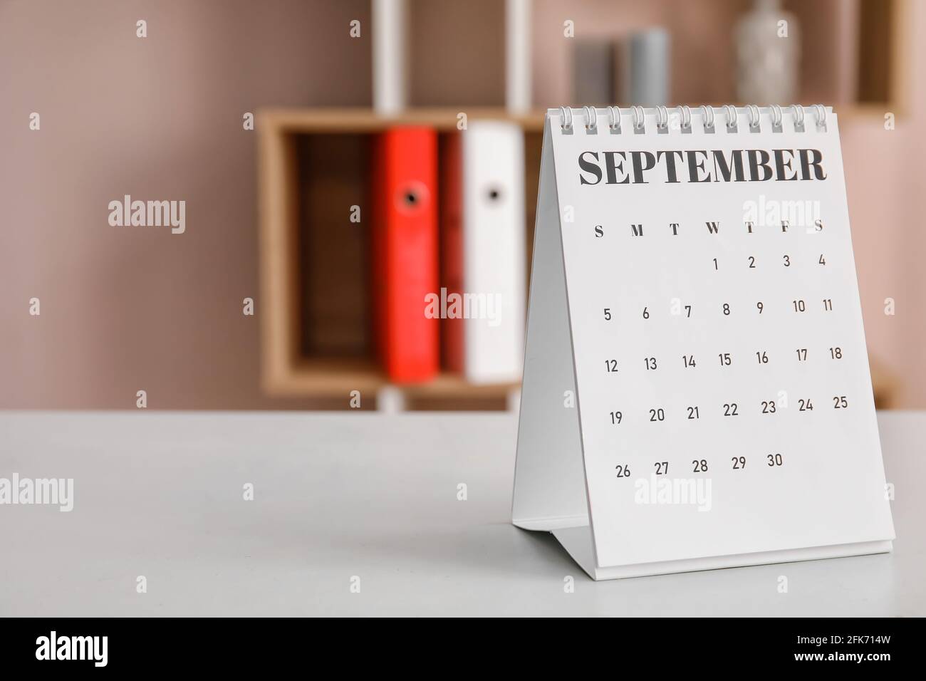 Flip paper calendar on table in office Stock Photo - Alamy