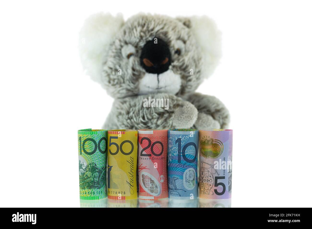 Rolls of Australia Banknote with blurred Koala background. Different ...