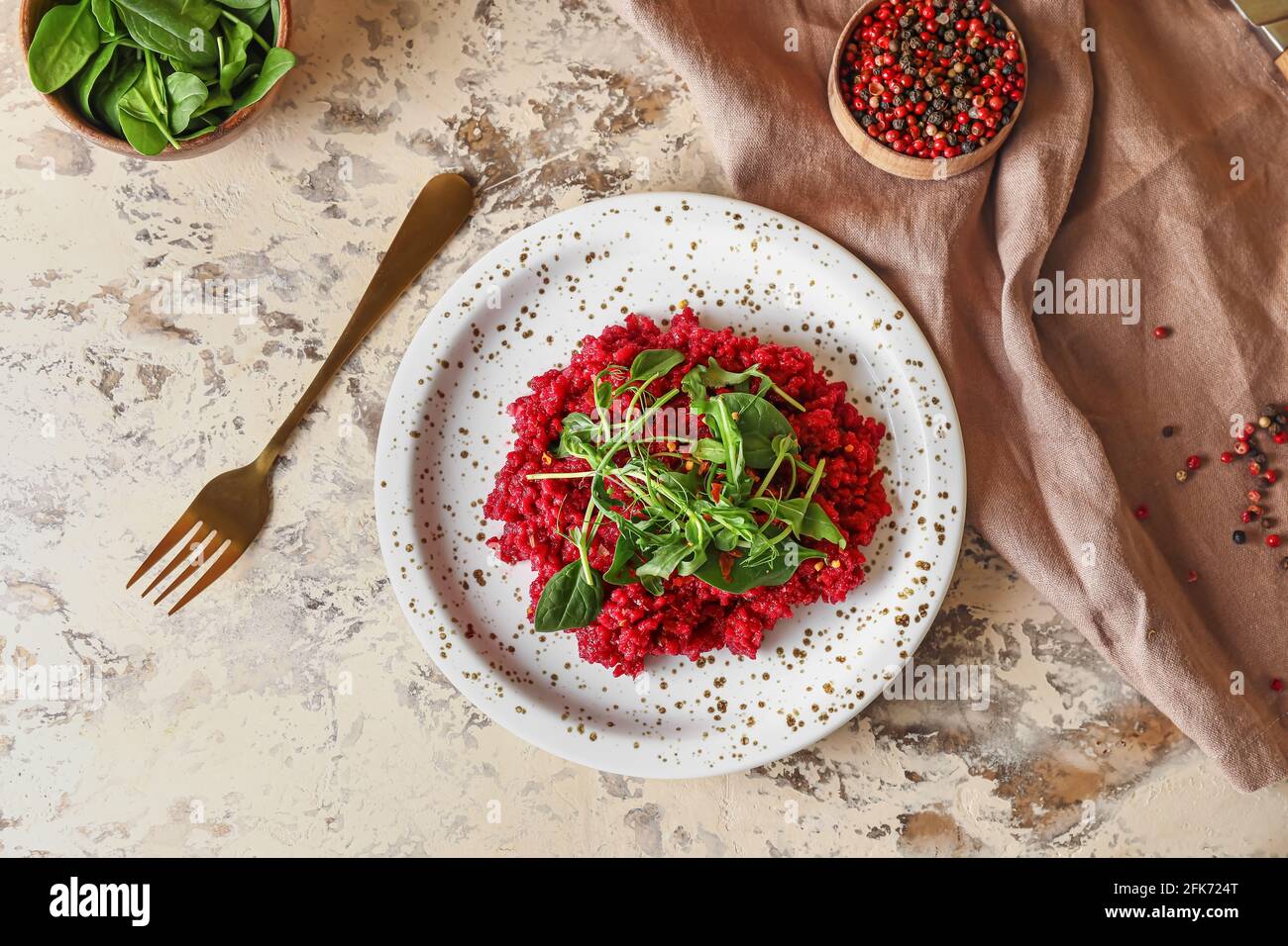 Plate with tasty beet risotto on grunge background Stock Photo - Alamy
