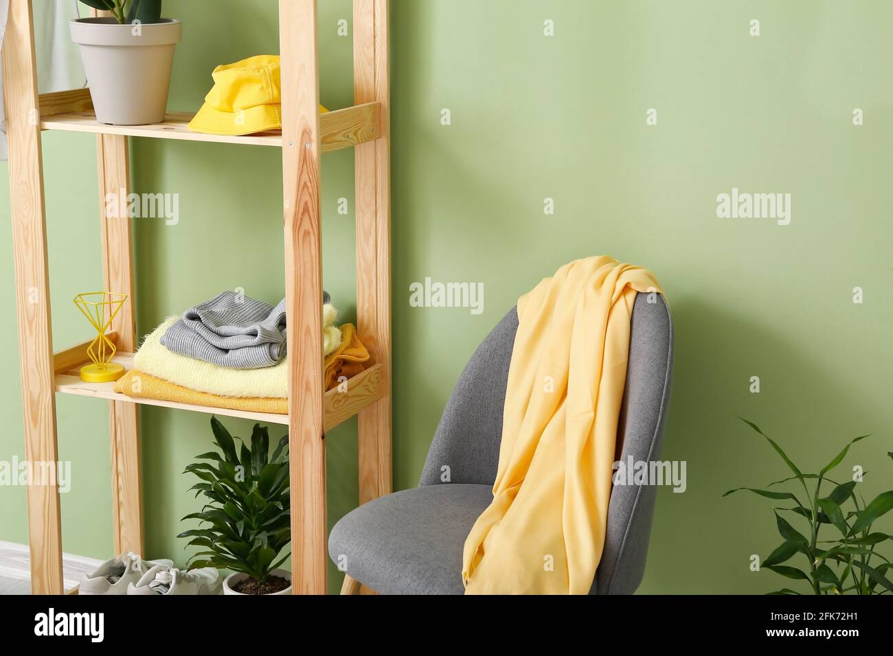 Rack with clothes and chair in dressing room Stock Photo - Alamy