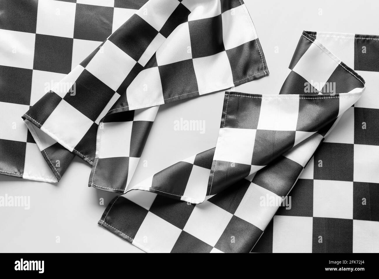 Racing flags on light background Stock Photo - Alamy