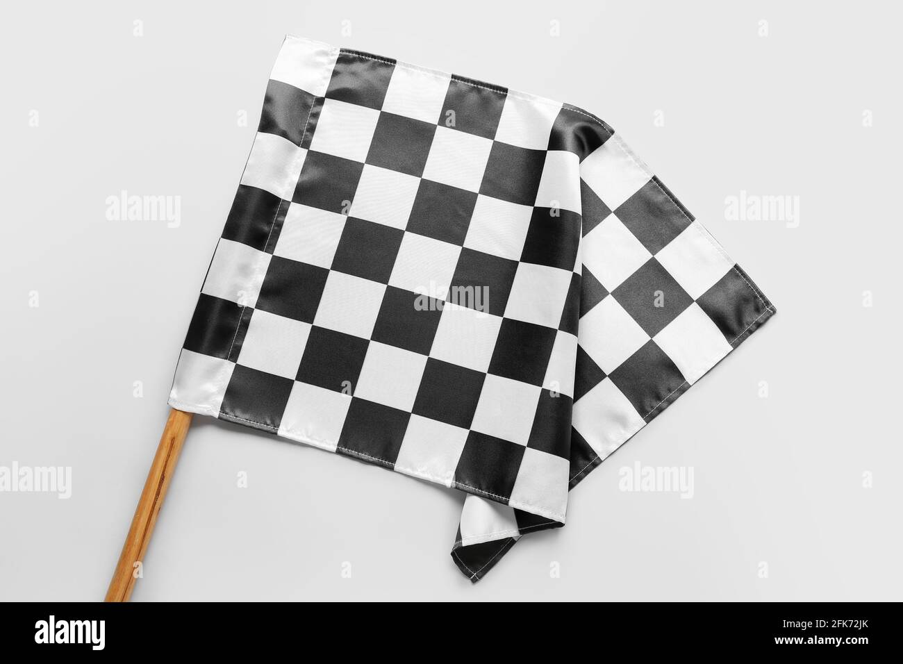 Racing flag on light background Stock Photo - Alamy