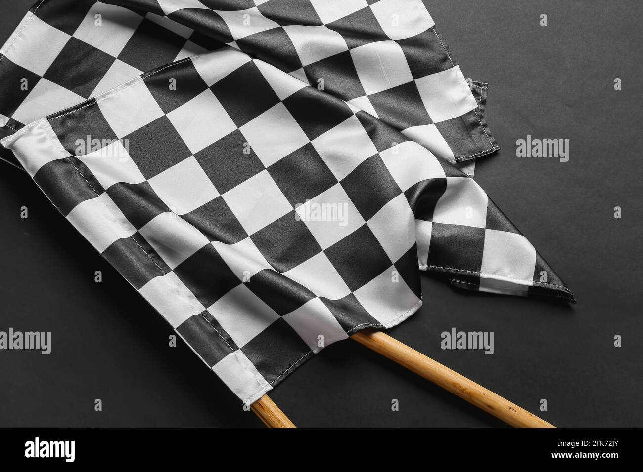 Racing flags on dark background Stock Photo - Alamy