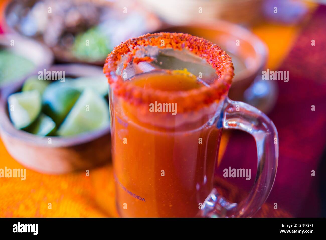 Traditional Mexican michelada in glass mug with blurry background Stock ...