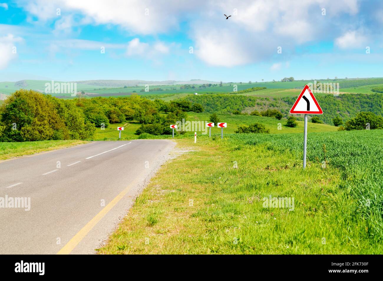 Road sign turn on the highway Stock Photo - Alamy