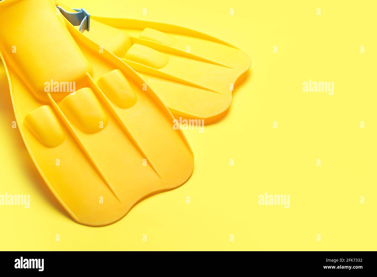 Stylish flippers on color background Stock Photo - Alamy
