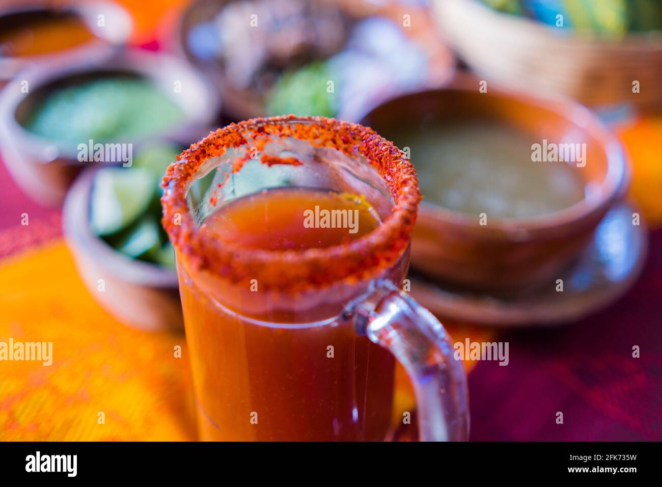 Traditional Mexican michelada in glass mug with blurry background Stock ...