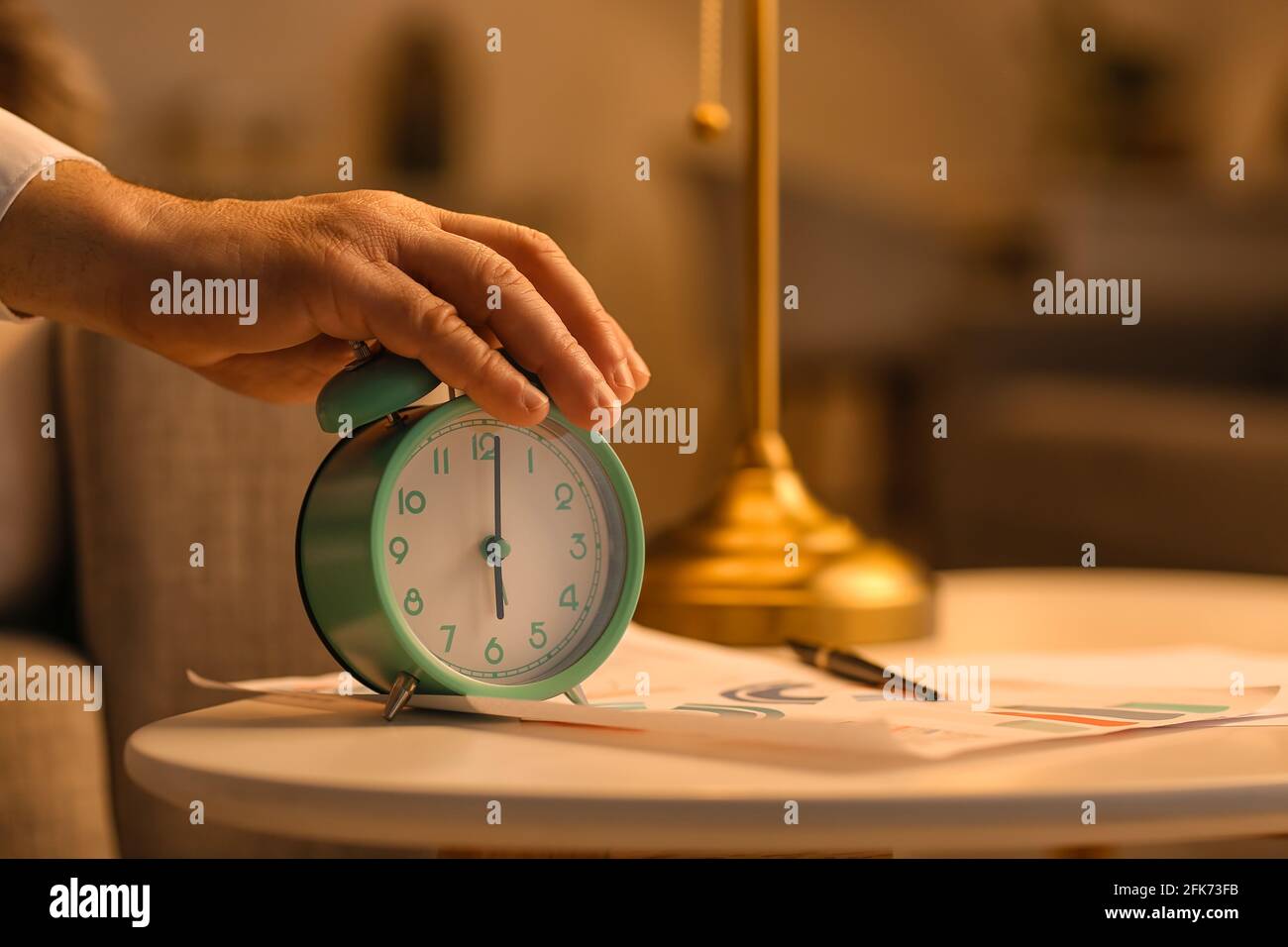 Man alarm clock switch off hi-res stock photography and images - Alamy
