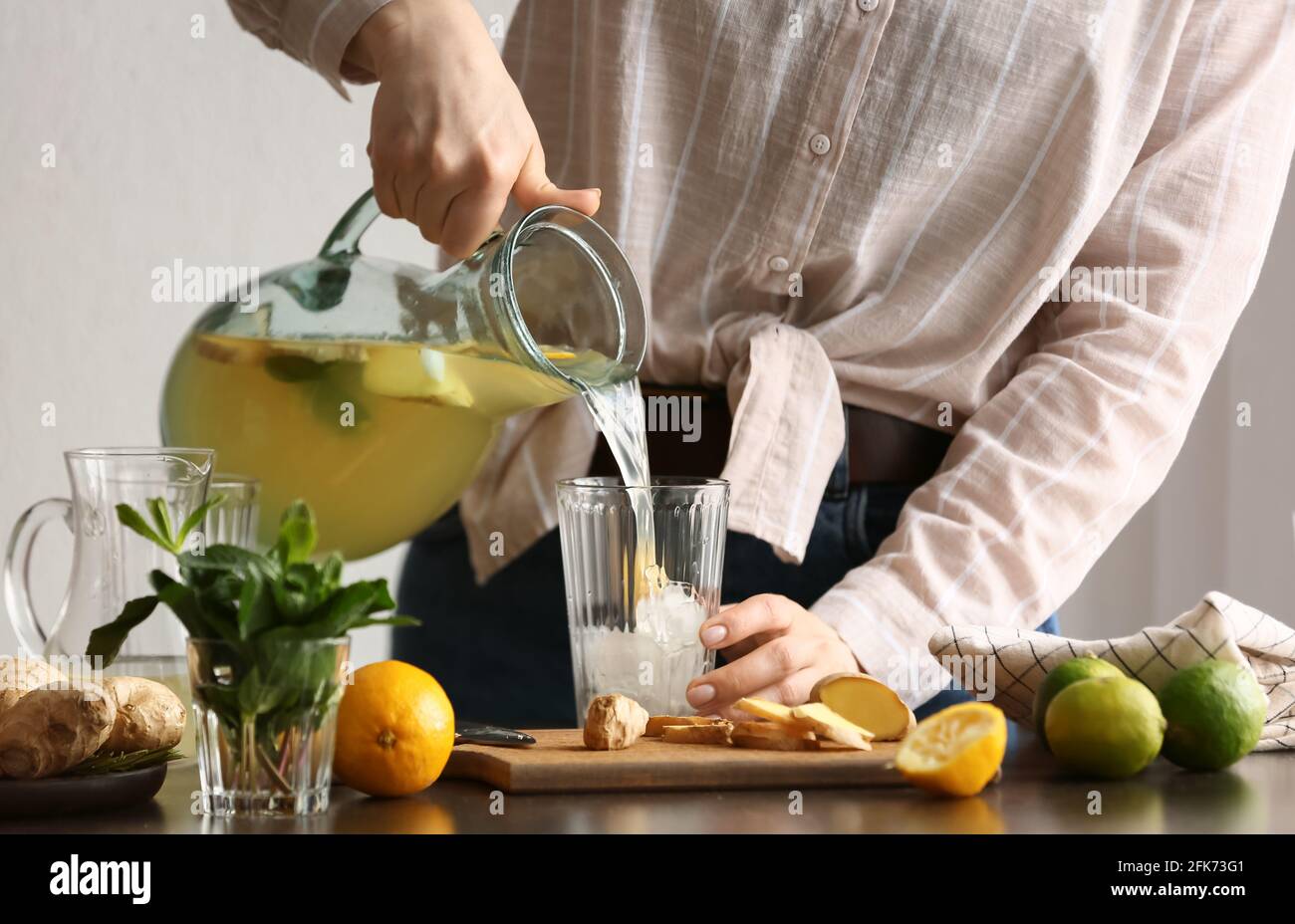 Woman pouring tasty lemonade hi-res stock photography and images - Alamy