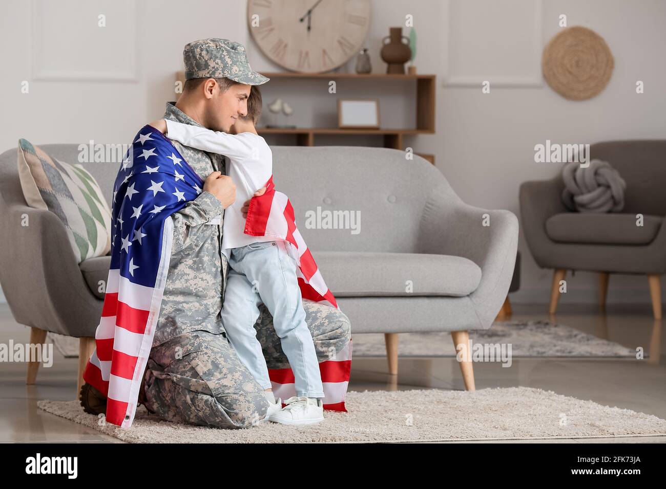 Soldier and his little son hugging at home. Memorial Day celebration ...