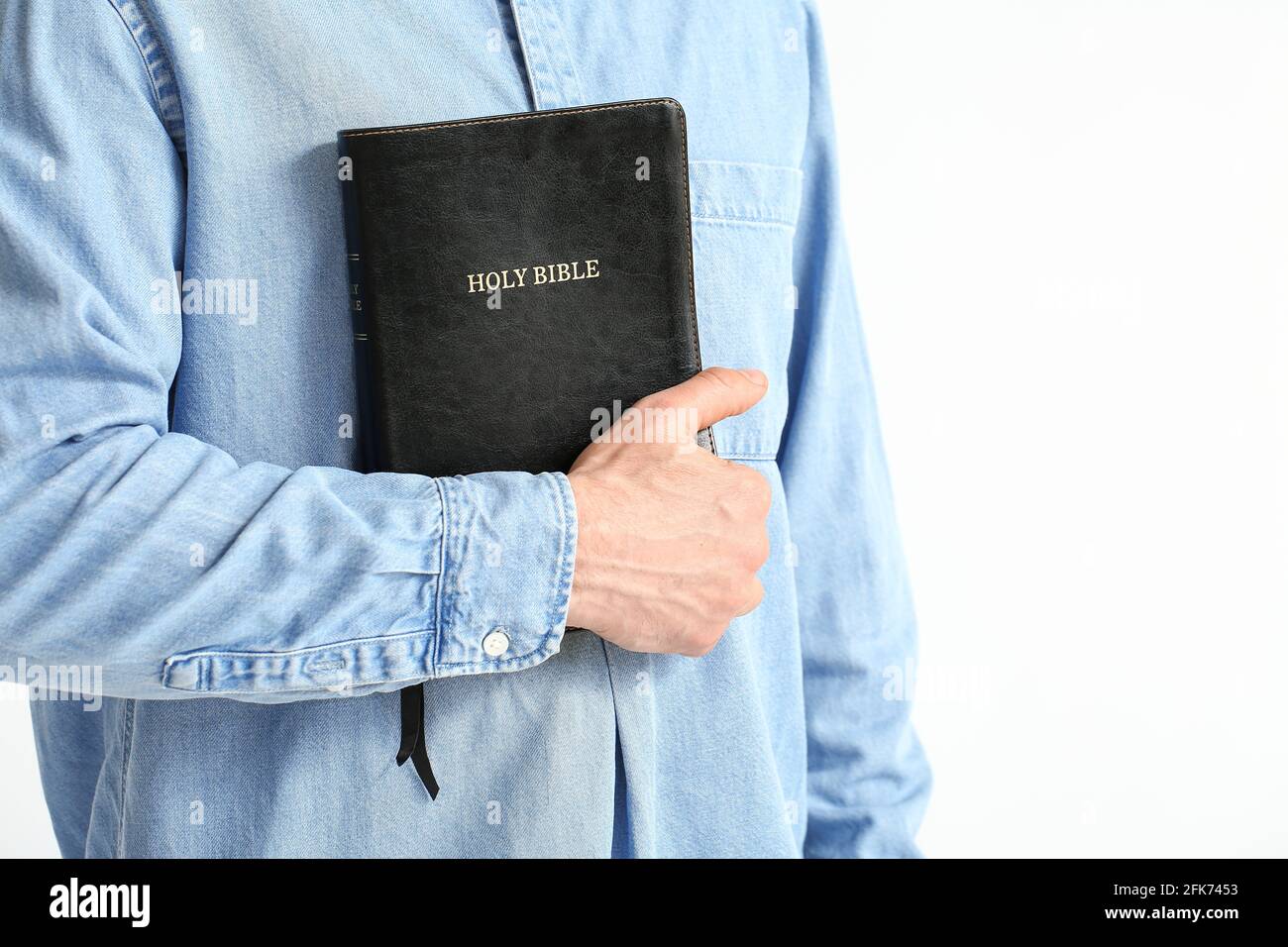 Man with Bible on white background, closeup Stock Photo - Alamy