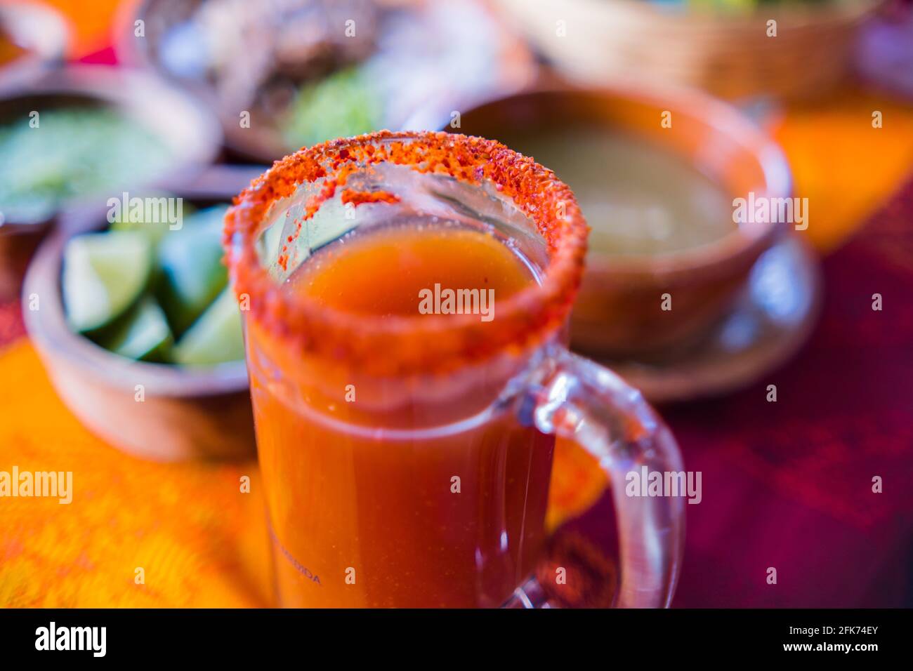 Traditional Mexican michelada in glass mug with blurry background Stock ...