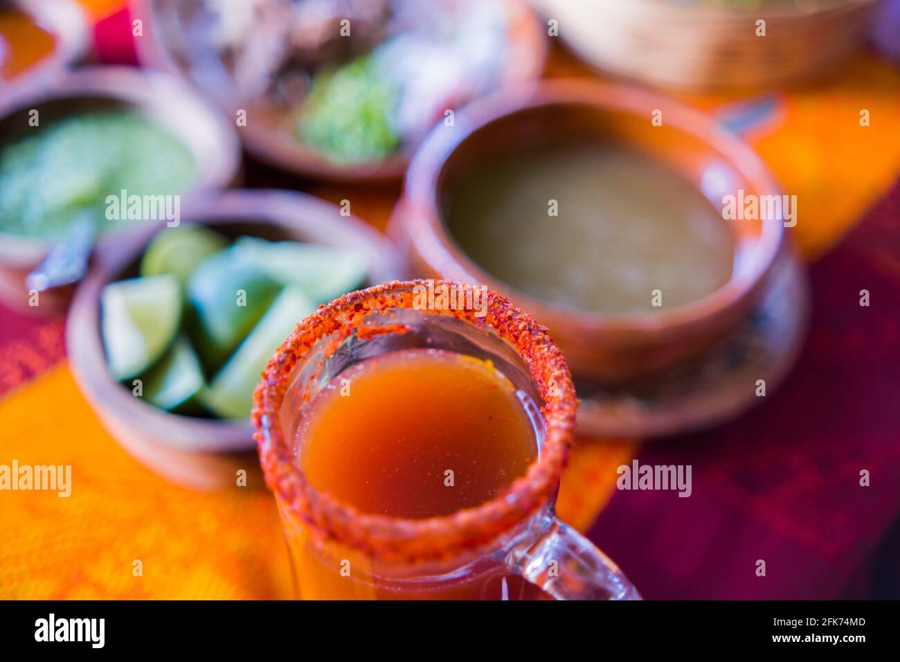 Traditional Mexican michelada in glass mug with blurry background Stock ...