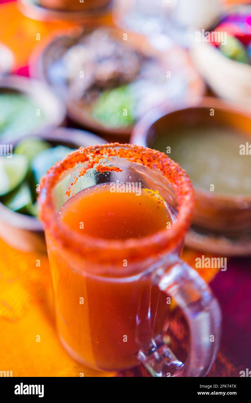 Traditional Mexican michelada in glass mug with blurry background Stock ...