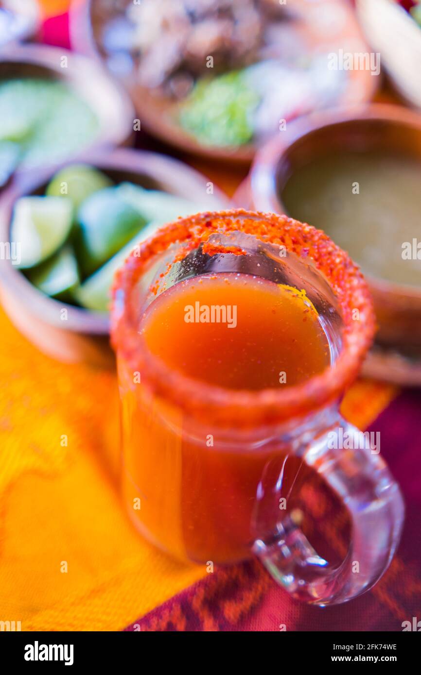 Traditional Mexican michelada in glass mug with blurry background Stock ...