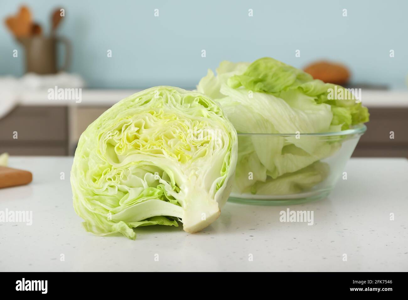 Iceberg lettuce on table in kitchen, closeup Stock Photo - Alamy