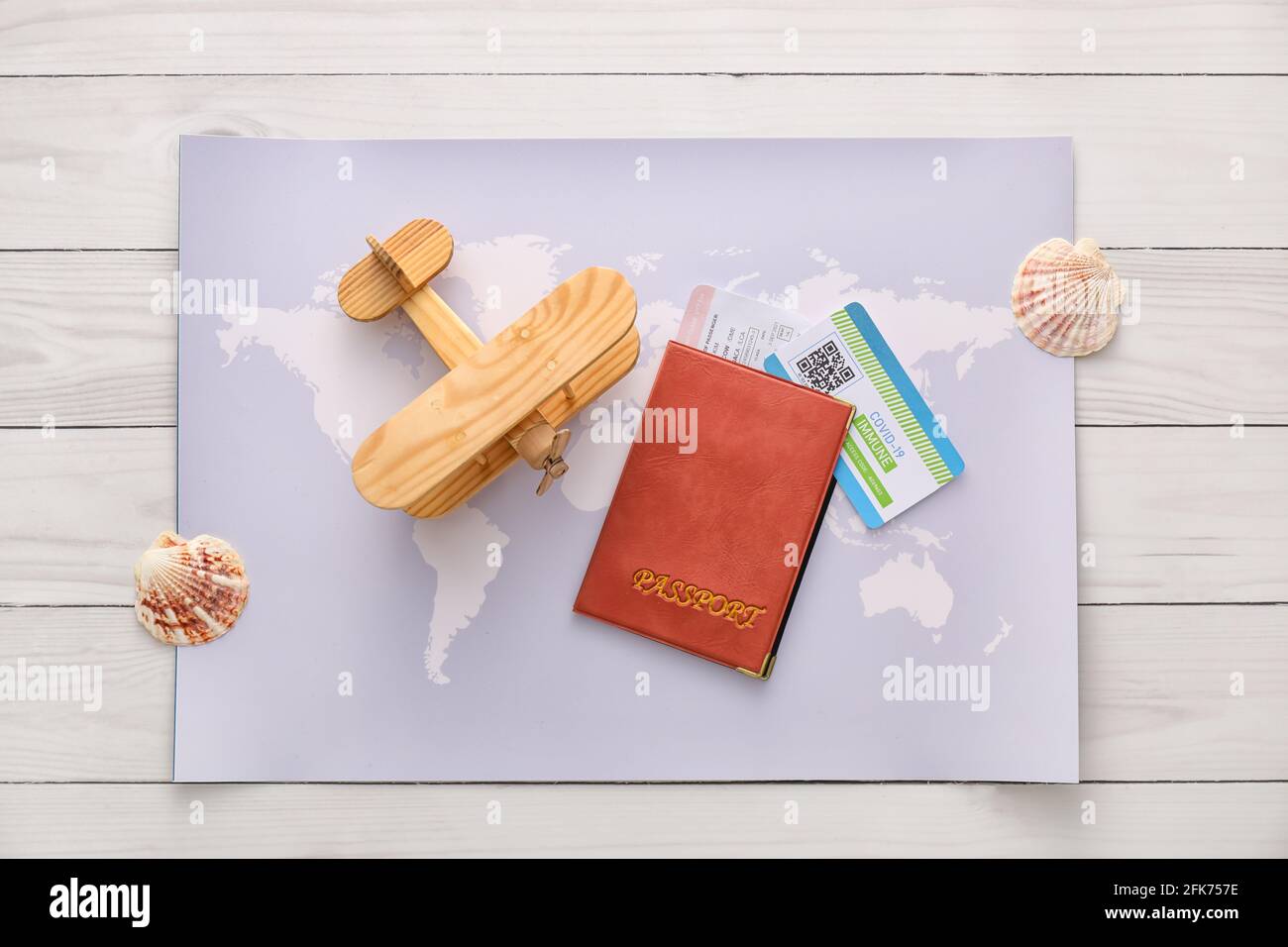 Travel supplies and covid-19 immune card on wooden background Stock ...