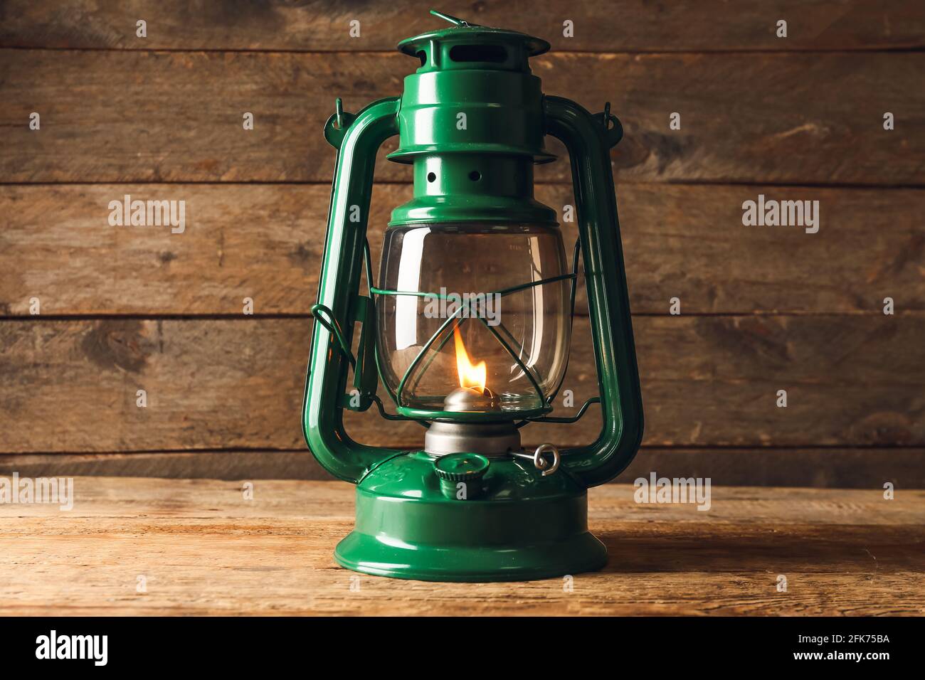 Stylish retro lamp on wooden background Stock Photo - Alamy