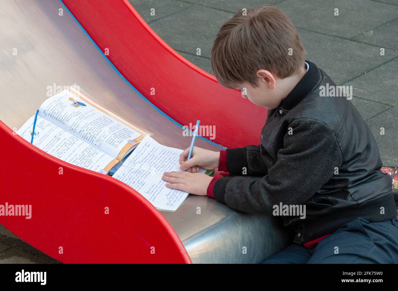 Krasnodar, Russia - April 28 2021: School boy doing his homework on the ...