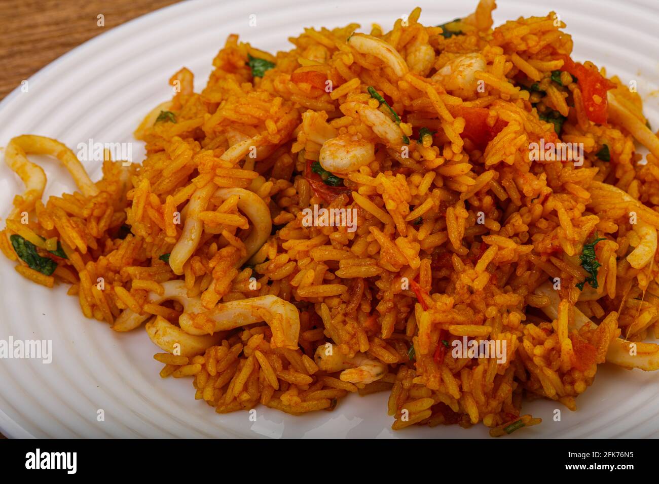 Asian cuisine - fried rice with prawn and squid Stock Photo - Alamy