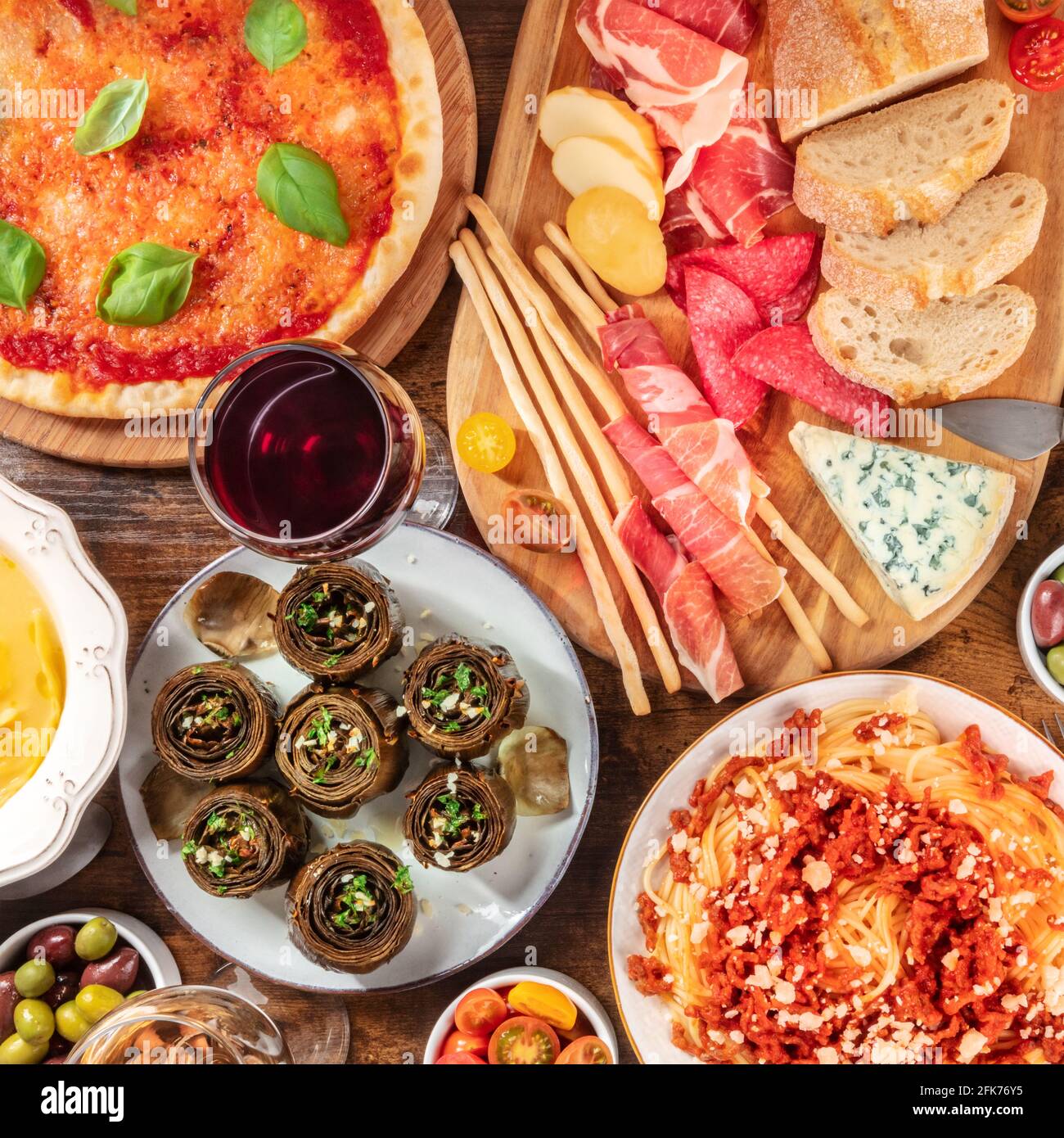 Italian cuisine square overhead shot with antipasti, wine, pasta, pizza ...
