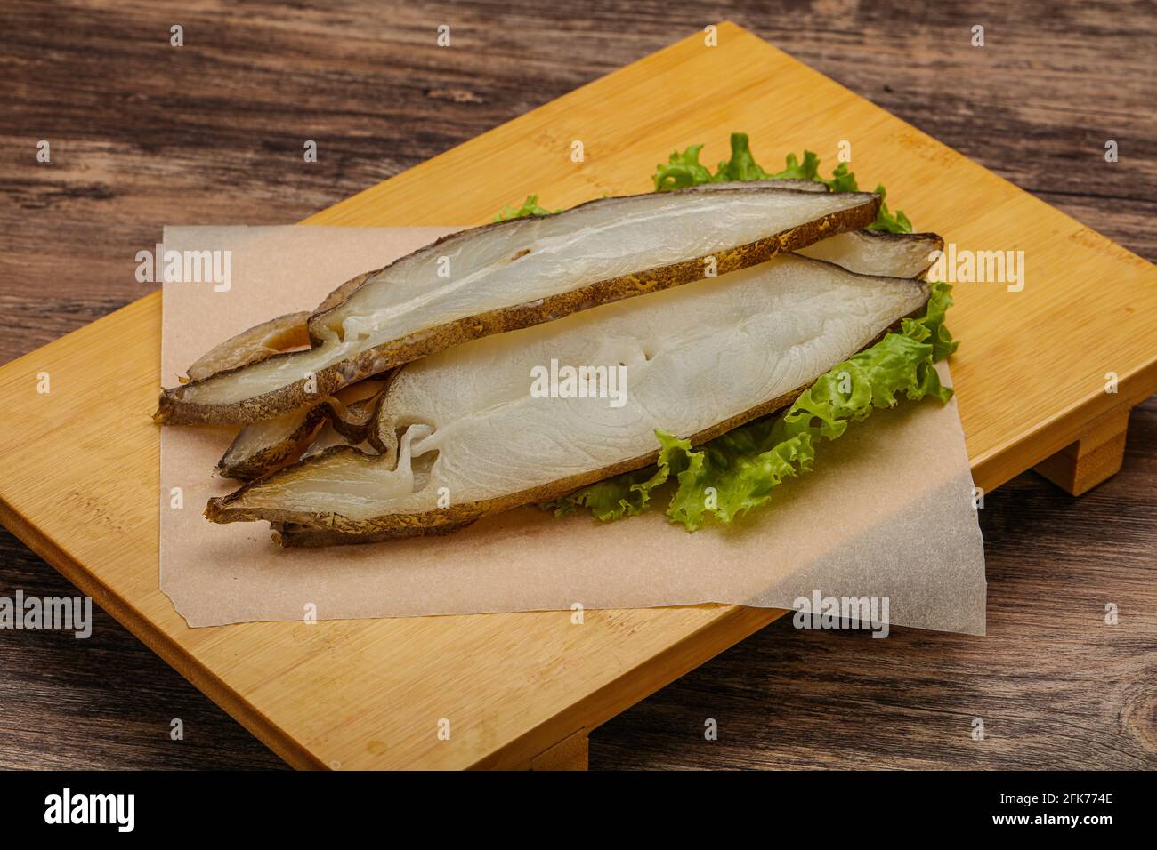 Delicous smoked halibut fish slices snack Stock Photo - Alamy