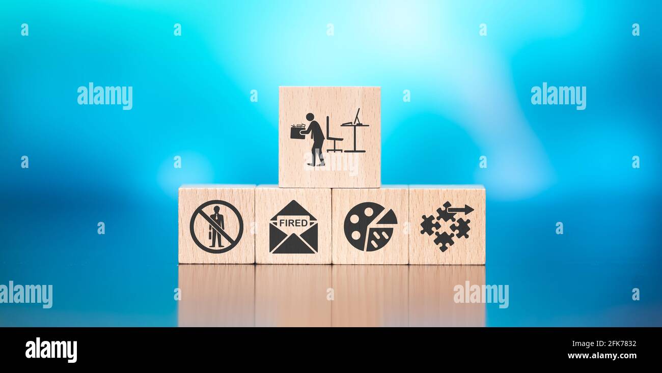 Wooden blocks with symbol of job loss concept on blue background Stock ...