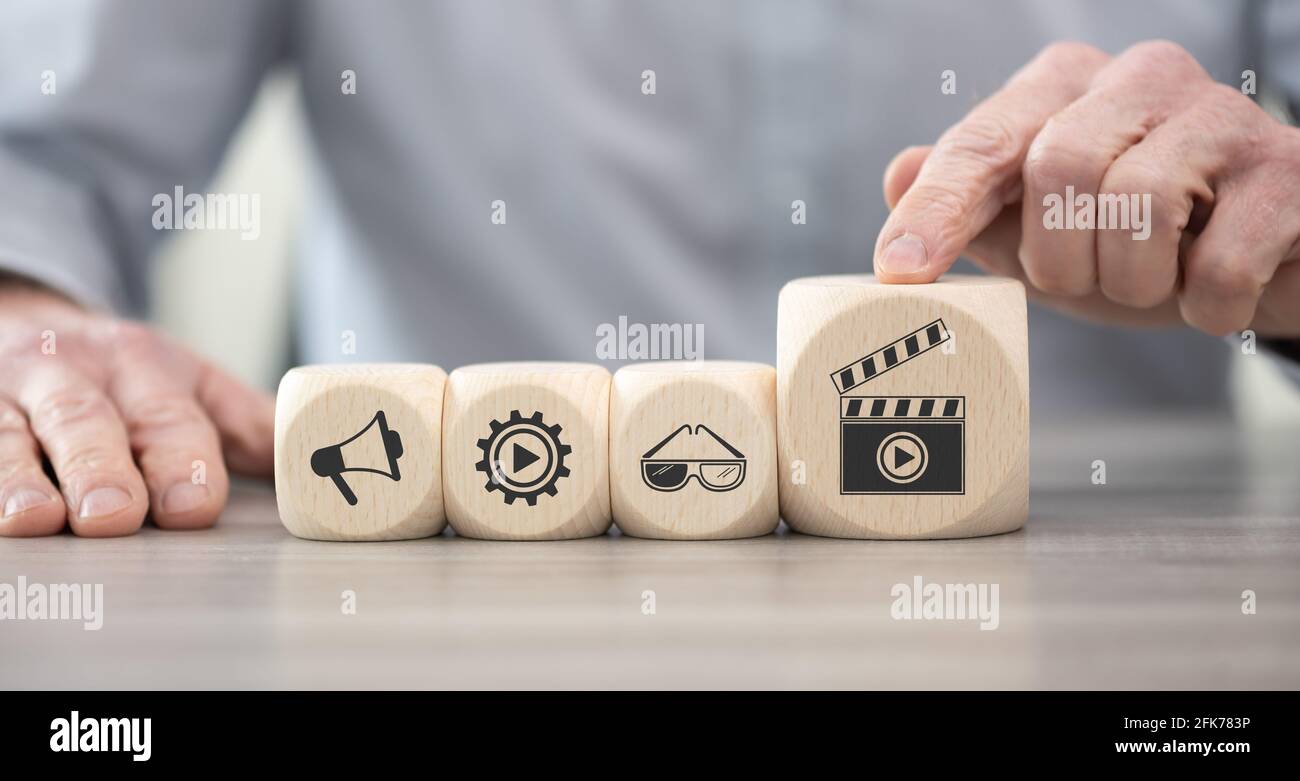 Wooden blocks with symbol of cinema concept Stock Photo - Alamy