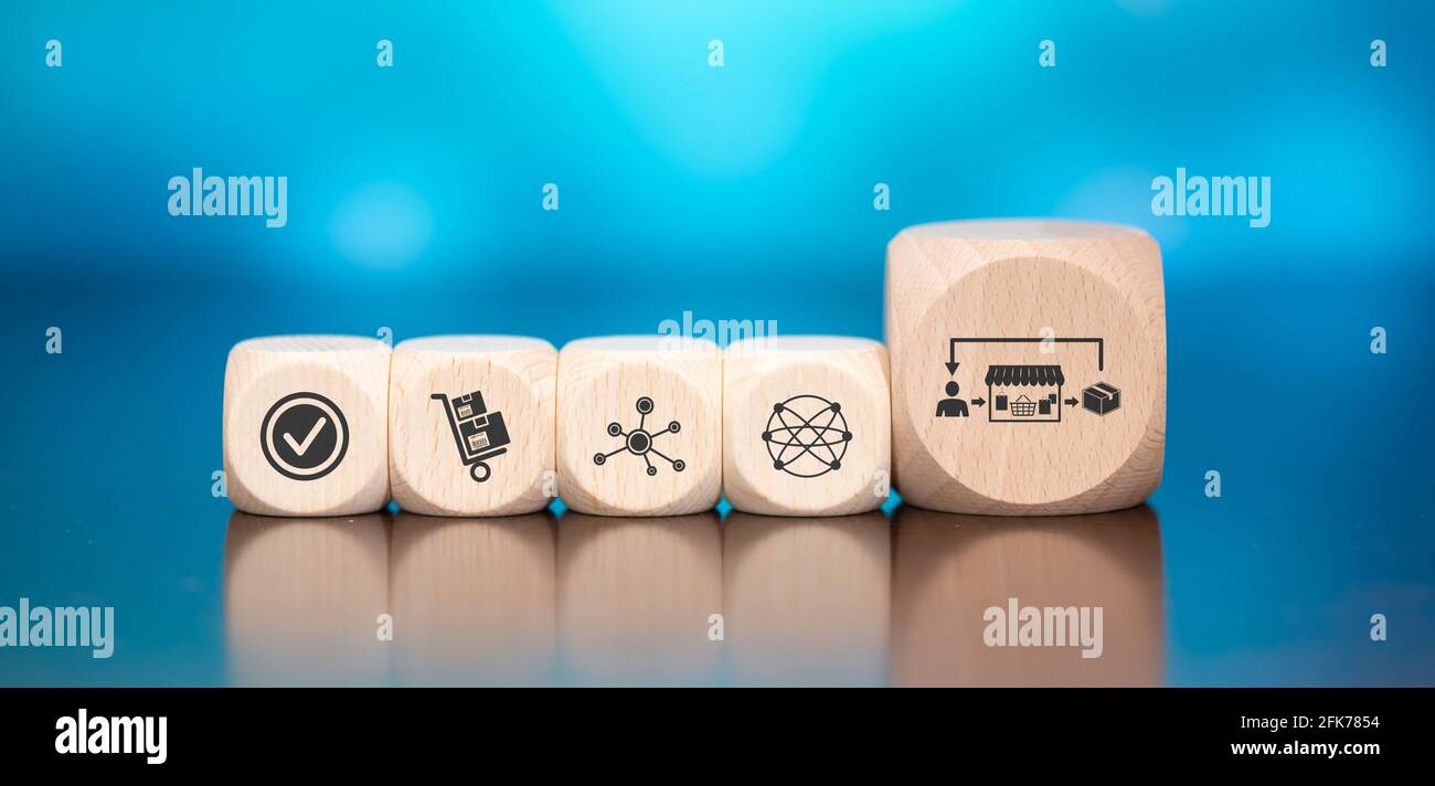 Wooden blocks with symbol of dropshipping concept on blue background ...