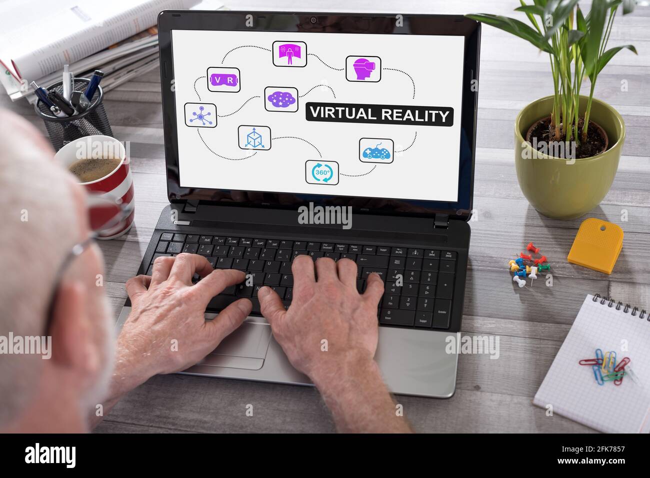 Virtual reality concept shown on a laptop used by a man Stock Photo - Alamy