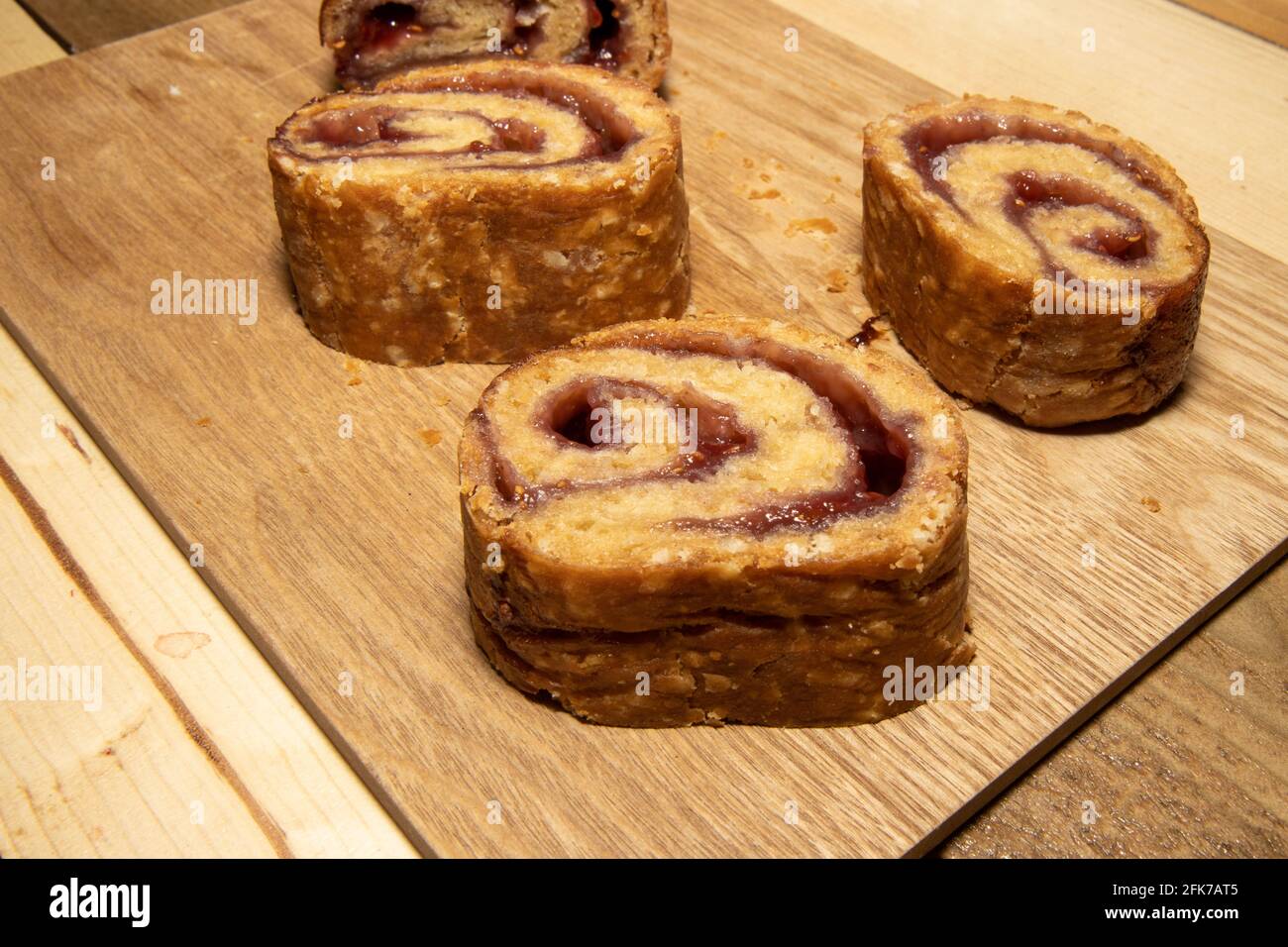 A delicious traditional British Jam Roly-Poly dessert cut in to slices ...