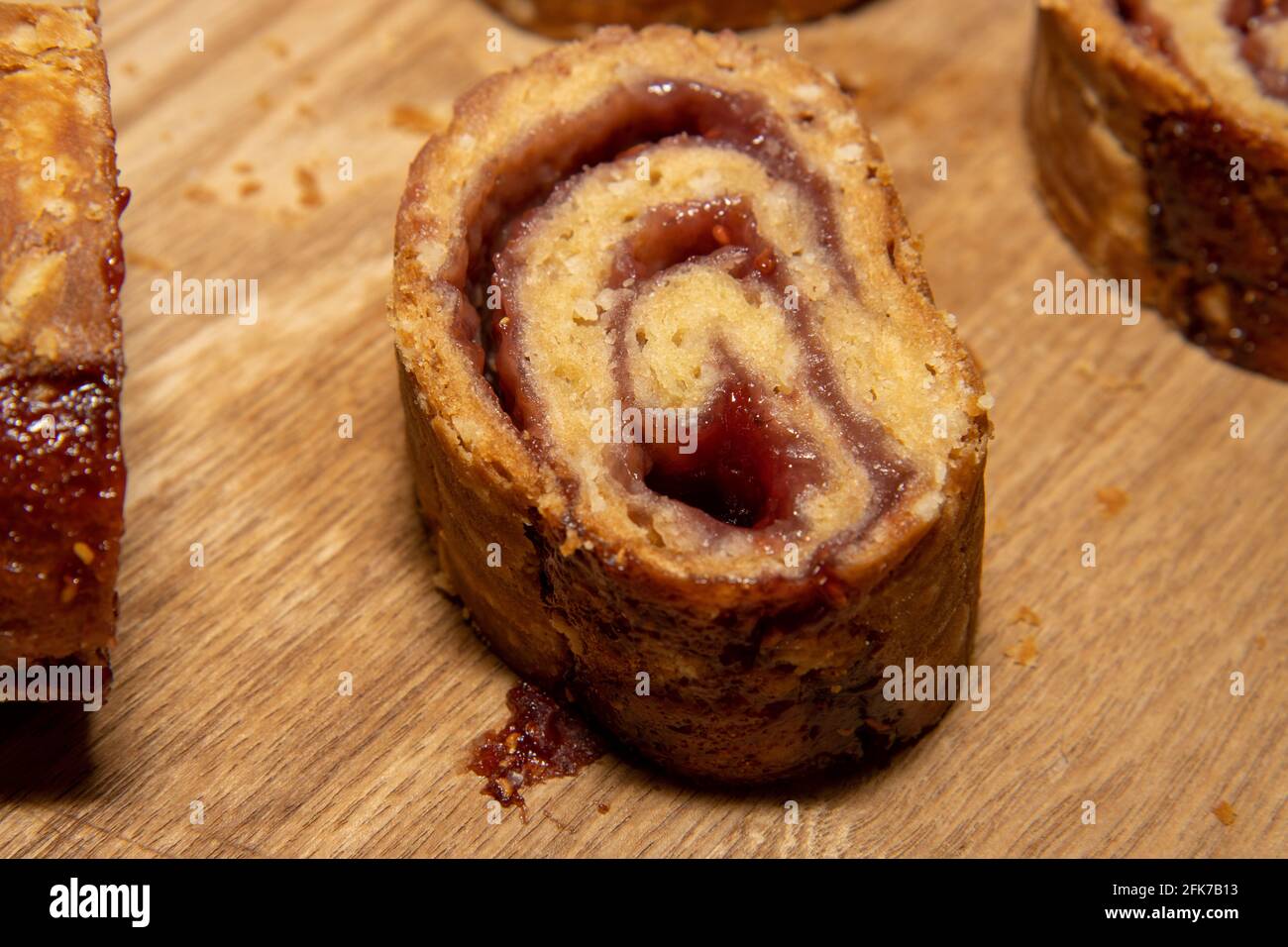 A delicious traditional British Jam Roly-Poly dessert cut in to slices ...