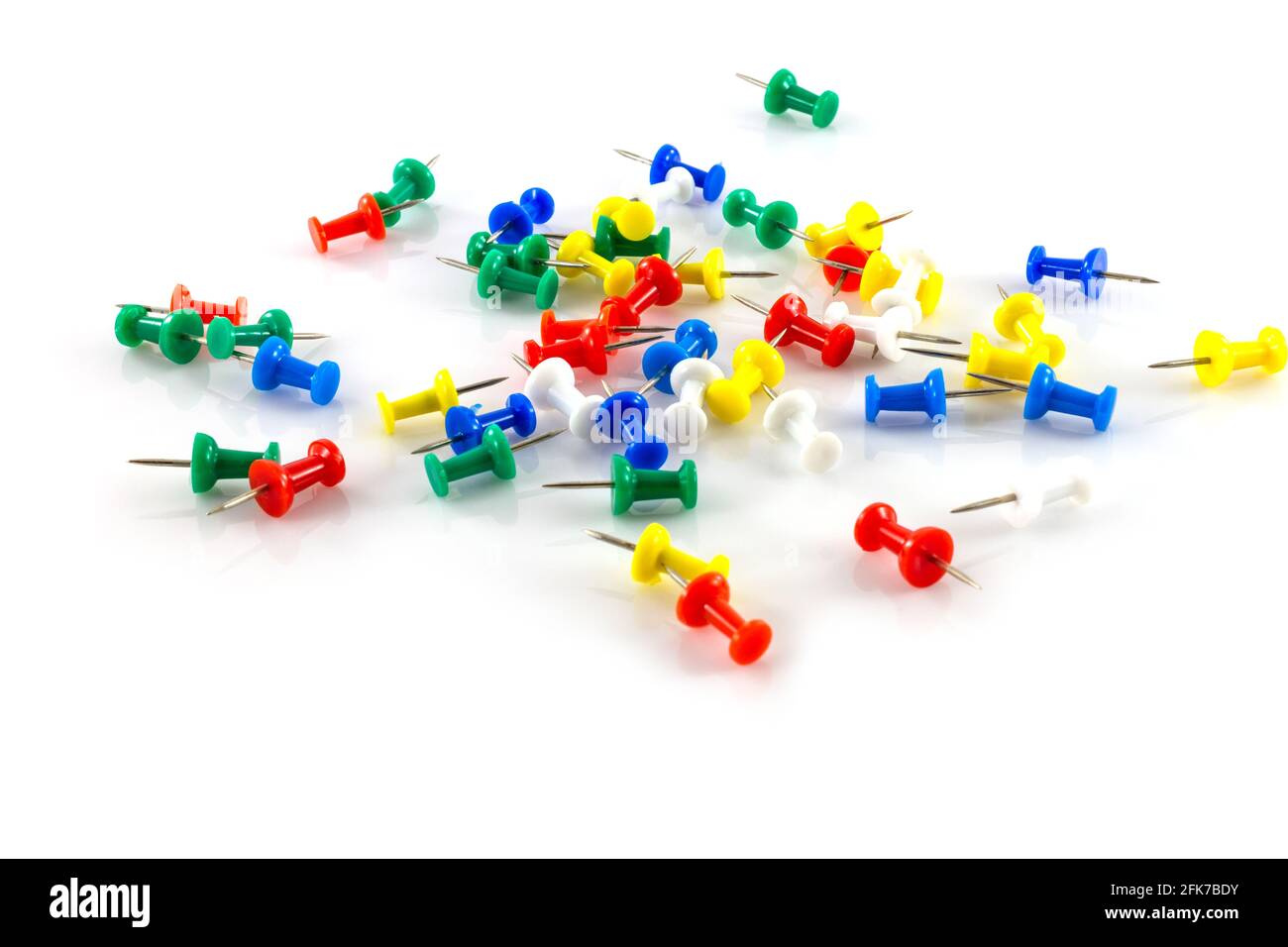 colorful push pins on white background Stock Photo - Alamy