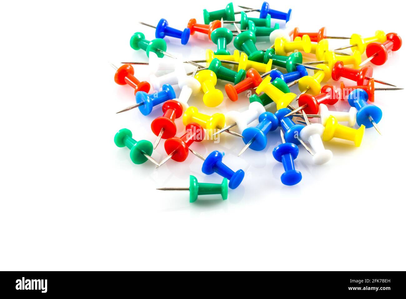 colorful push pins on white background Stock Photo - Alamy
