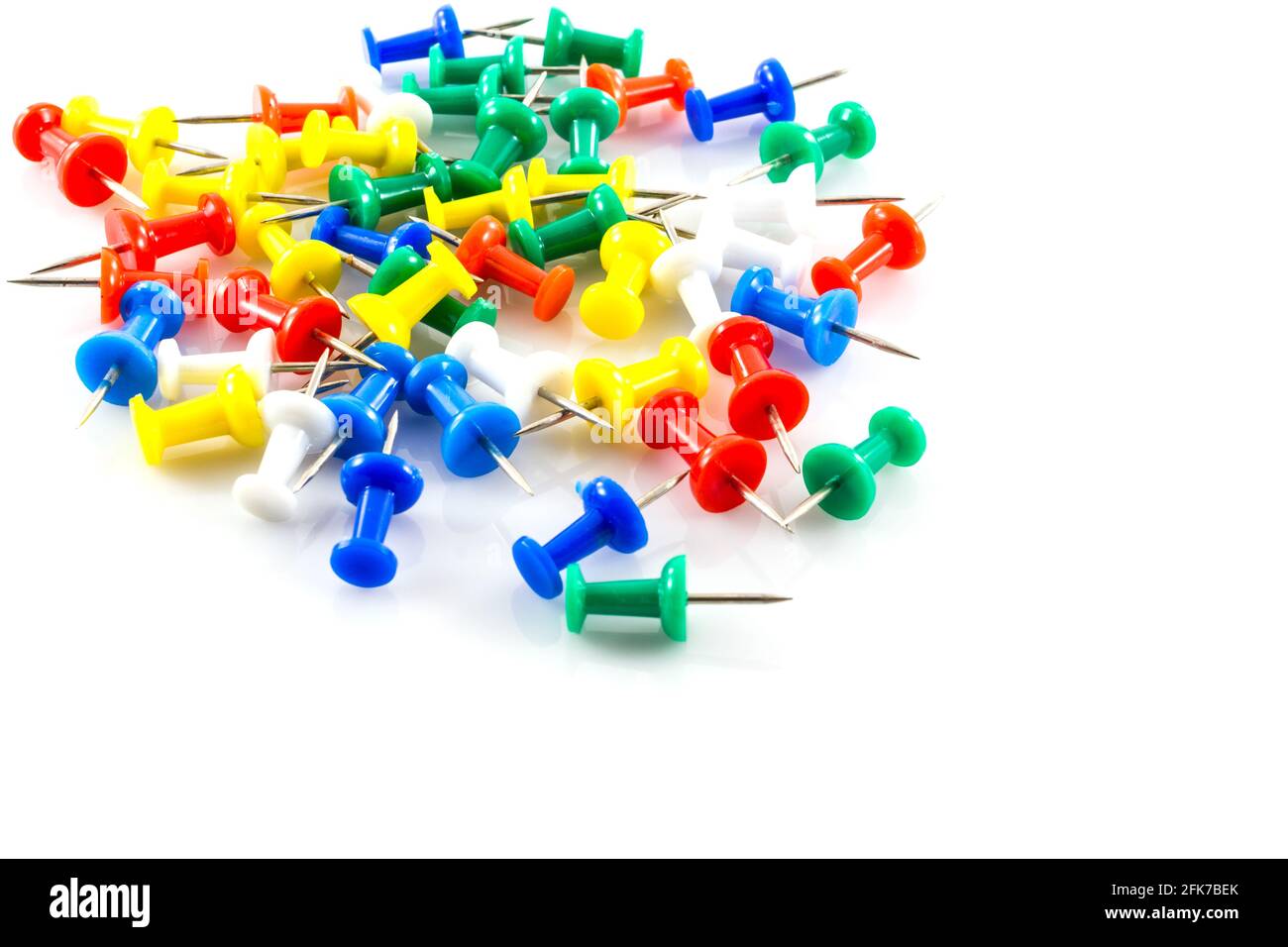 colorful push pins on white background Stock Photo - Alamy
