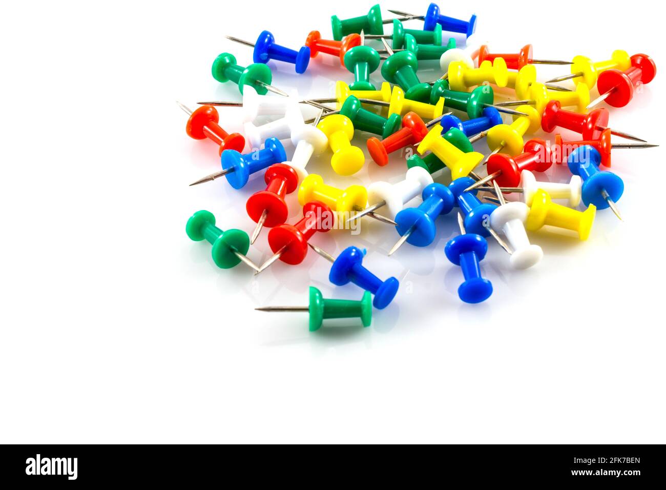 colorful push pins on white background Stock Photo - Alamy