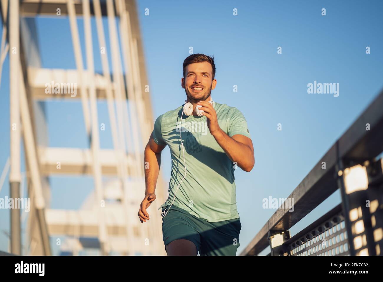 Happy man running on bridge hi-res stock photography and images - Alamy