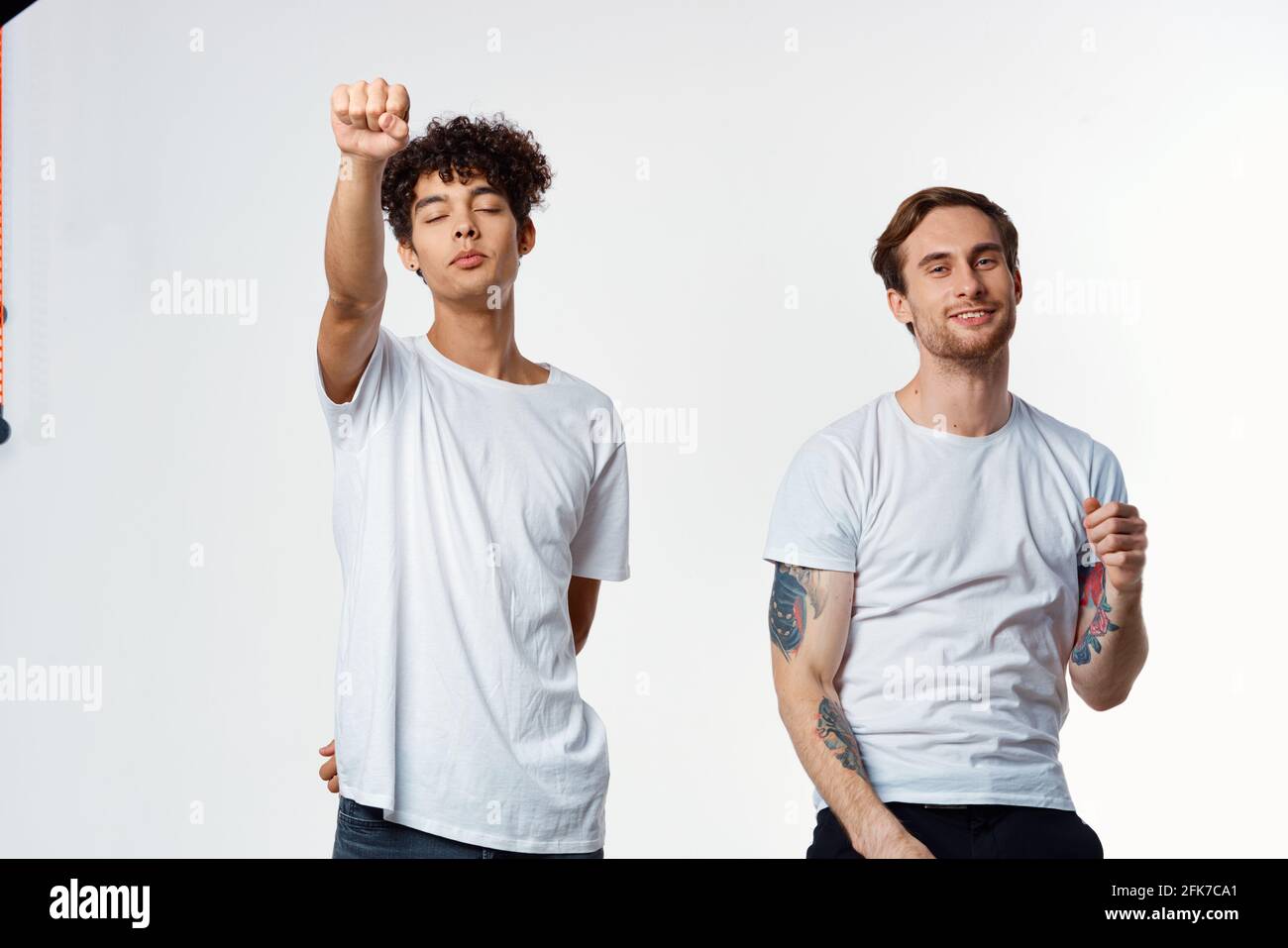 two joyful men friendship emotions communication studio Stock Photo - Alamy