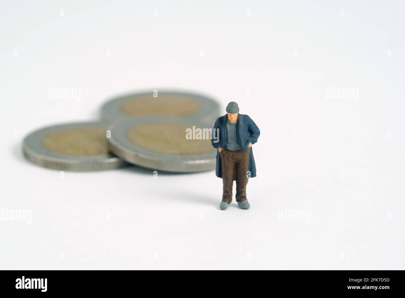 Poor man with coin money left. Miniature tiny people toys photography ...