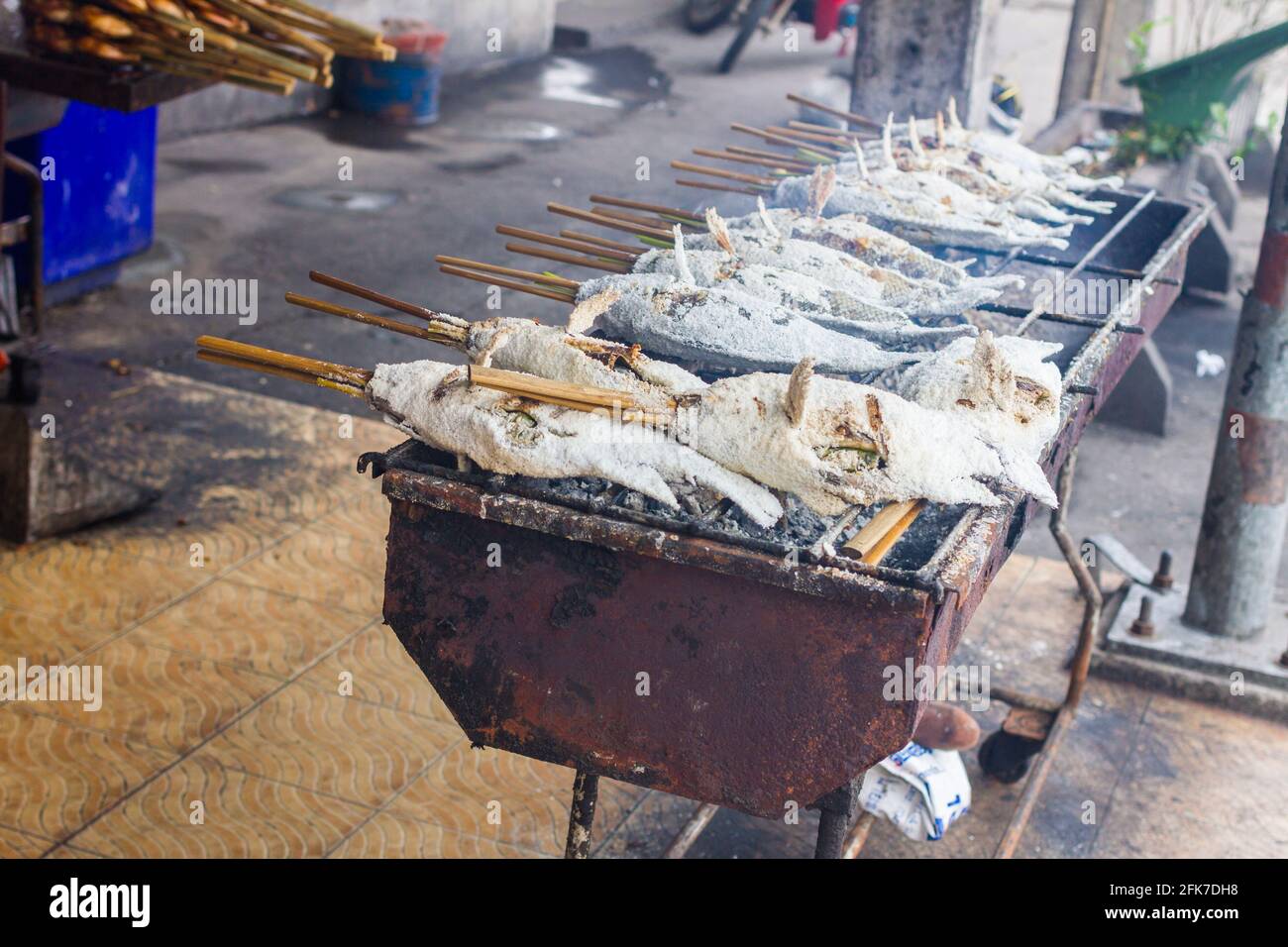 salted grill snakehead fish with herbs food Stock Photo - Alamy