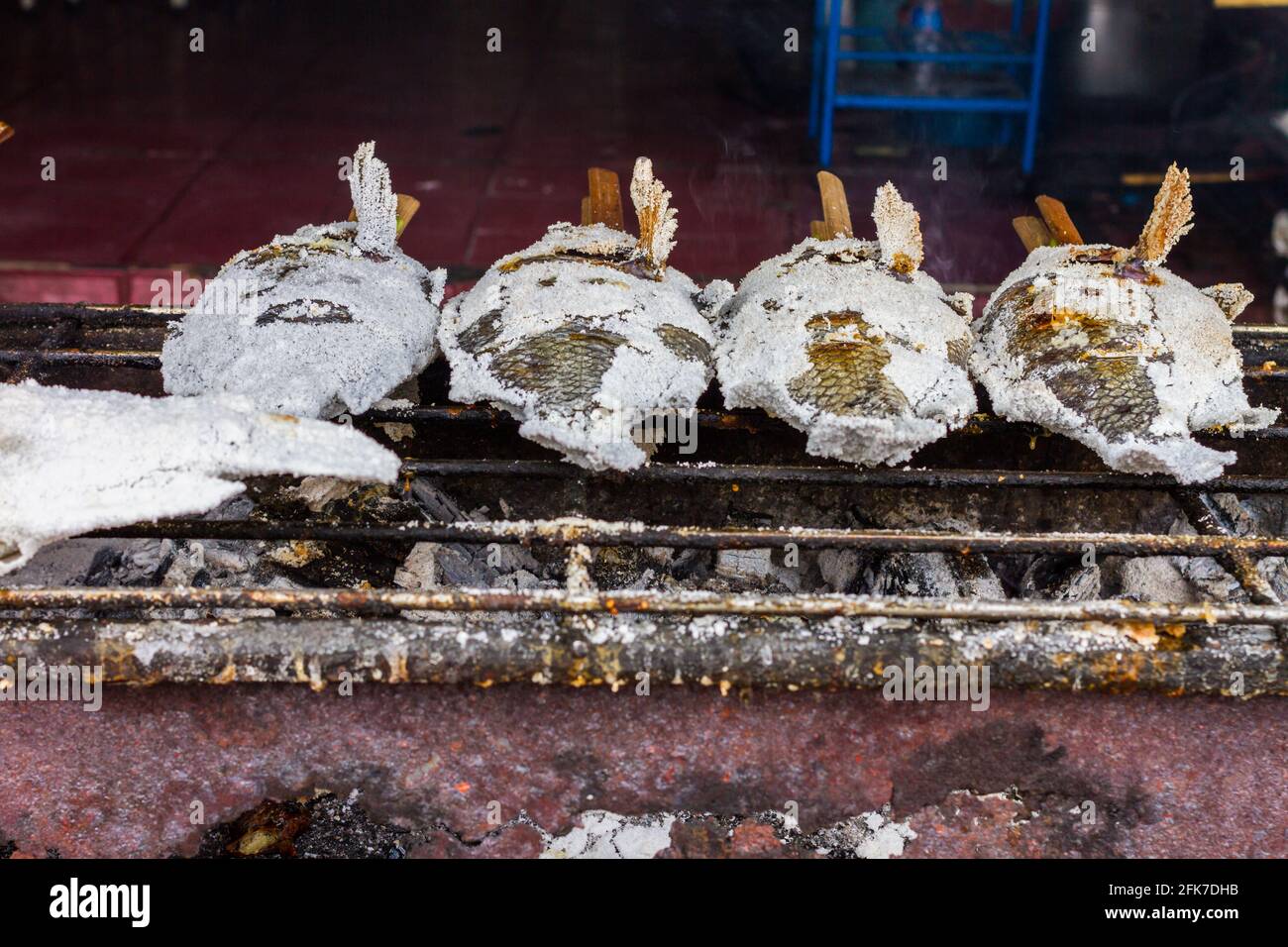 salted grill snakehead fish with herbs food Stock Photo - Alamy