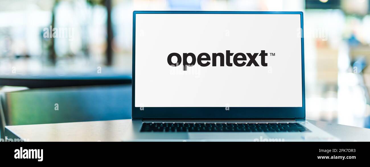 POZNAN, POL - APR 15, 2021: Laptop computer displaying logo of OpenText ...