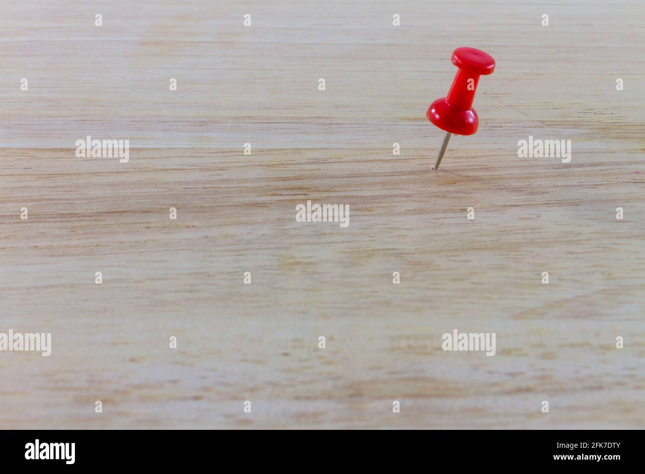 red pin on the wood background Stock Photo - Alamy