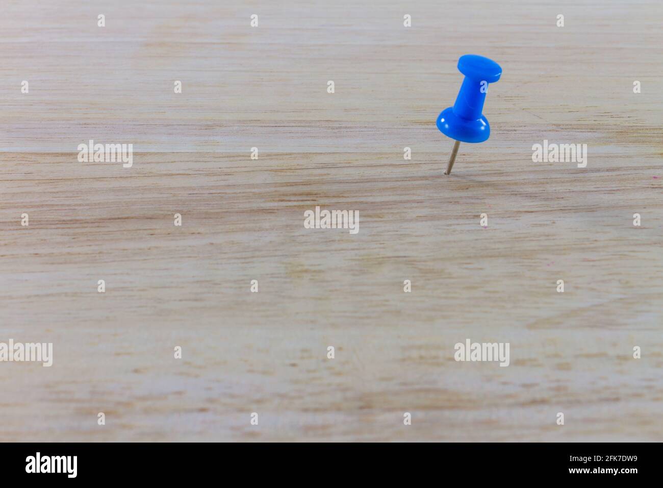 Blue pin on the woodbackground Stock Photo - Alamy