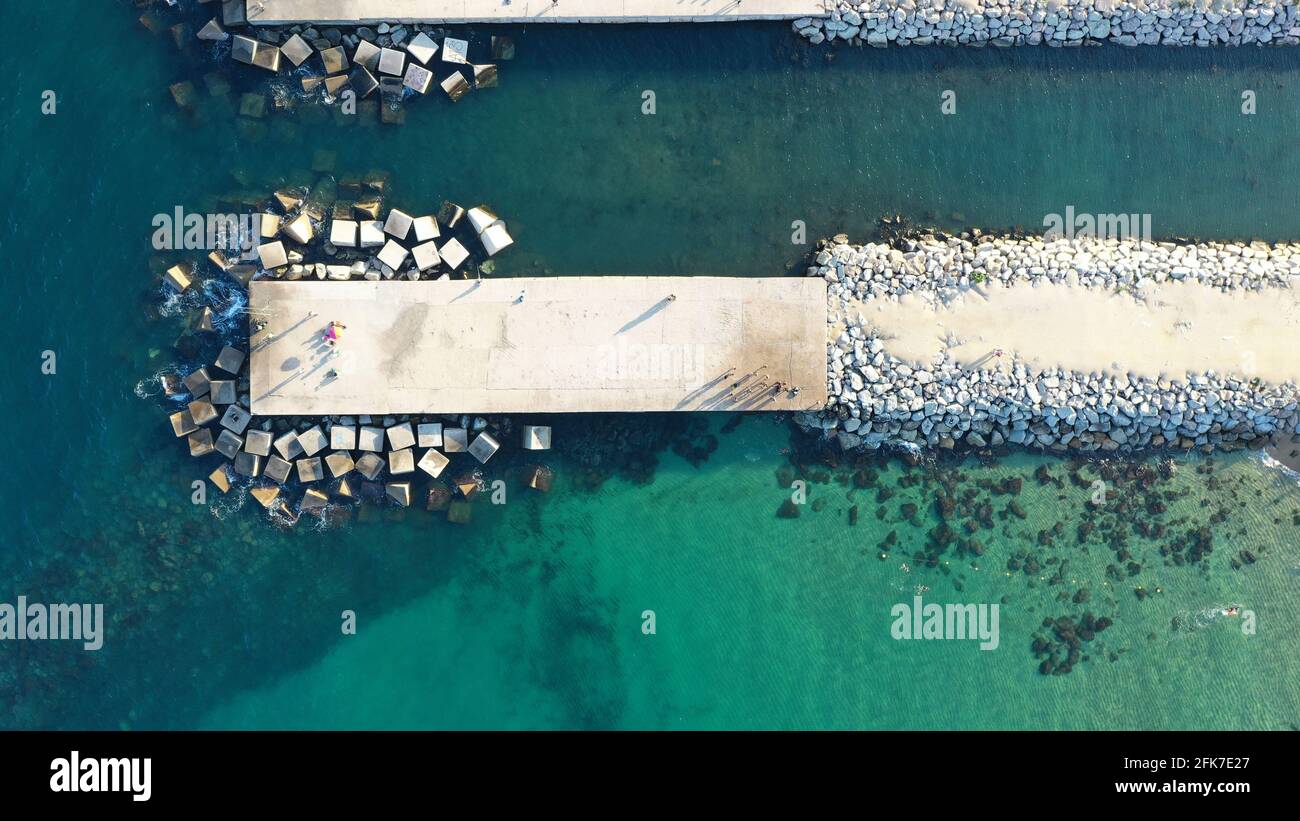 Top view of huge concrete wave breakers on a coast Stock Photo - Alamy