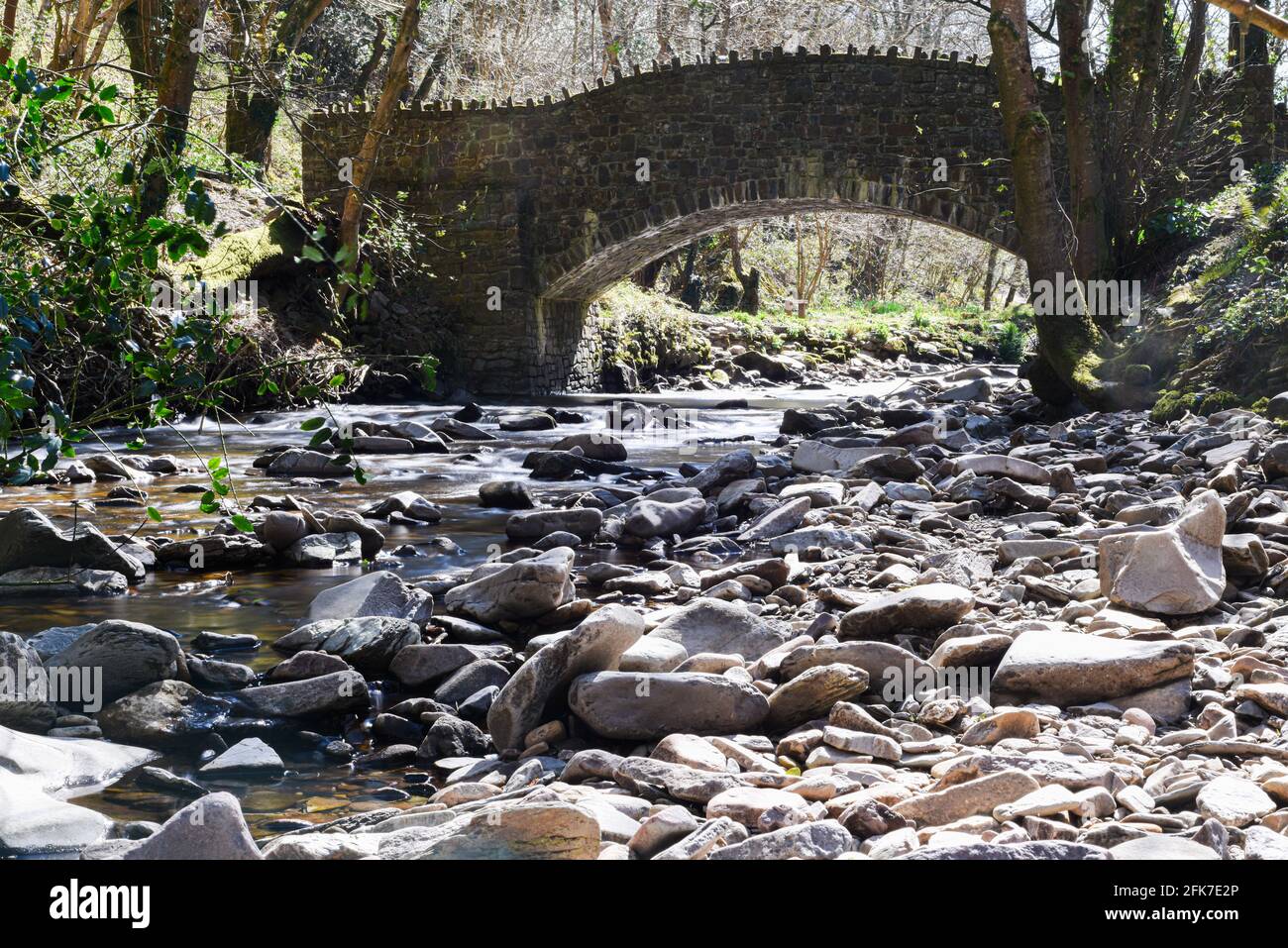 Scenic view of a river flowing under a bridge on a hiking trail in ...