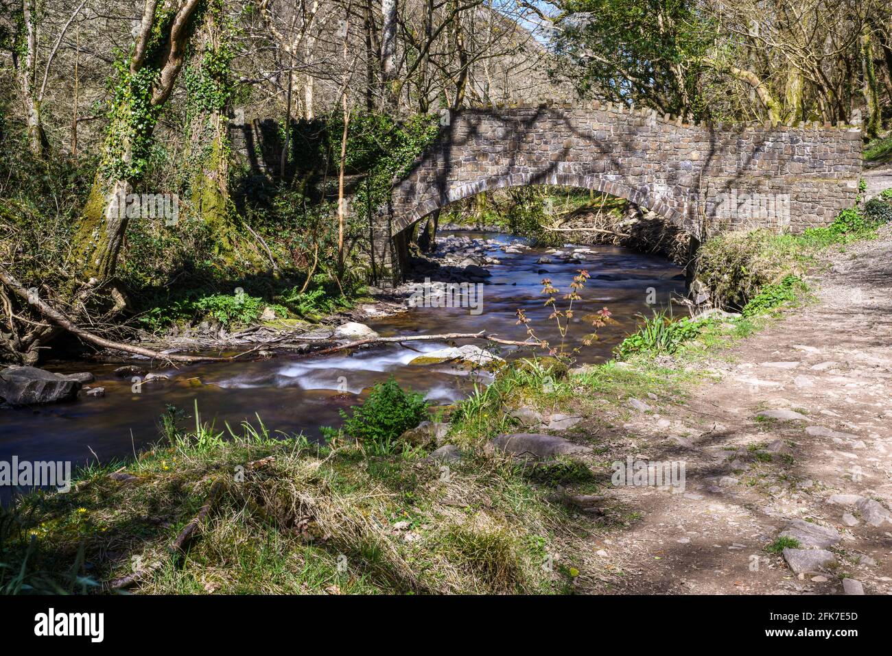 Scenic view of a river flowing under a bridge on a hiking trail in ...