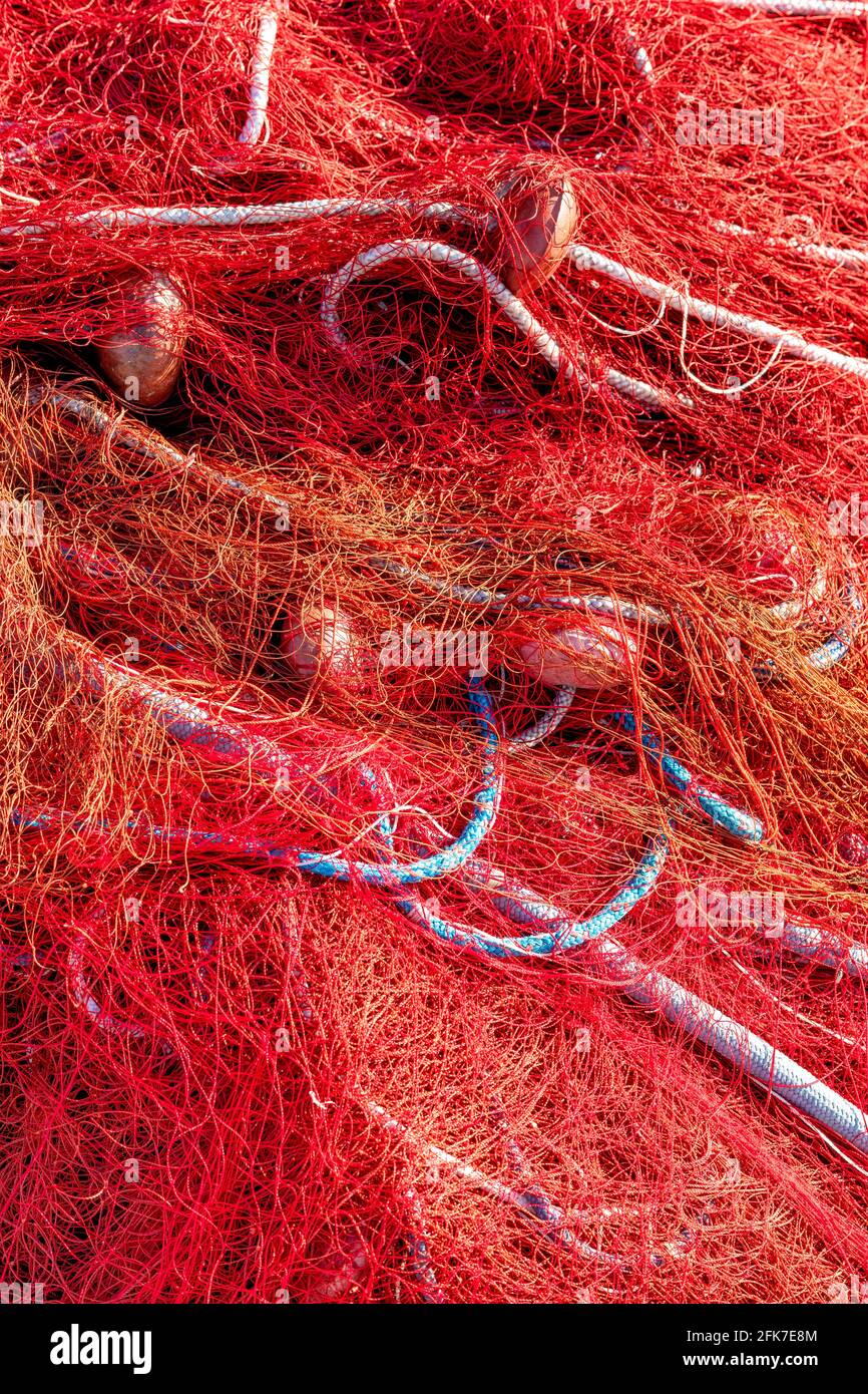 Red fishing nets with floats and ropes. Close-up shot, perfect image ...