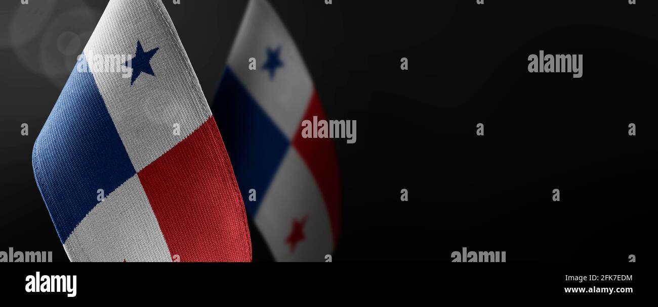 Small national flags of the Panama on a dark background Stock Photo - Alamy